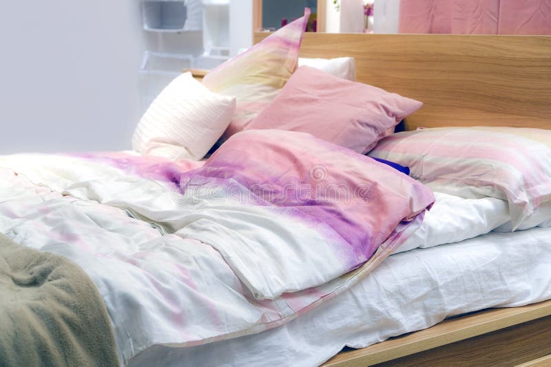 The Bedclothes are Crumpled. Pillows are Scattered at the Head of the ...