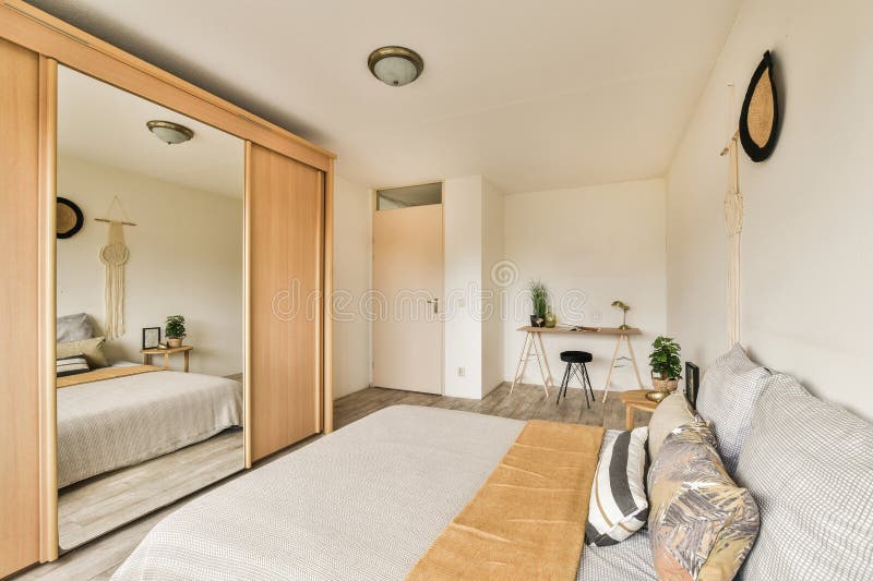 A Bedroom with a Bed and a Couch and a Editorial Image - Image of table ...