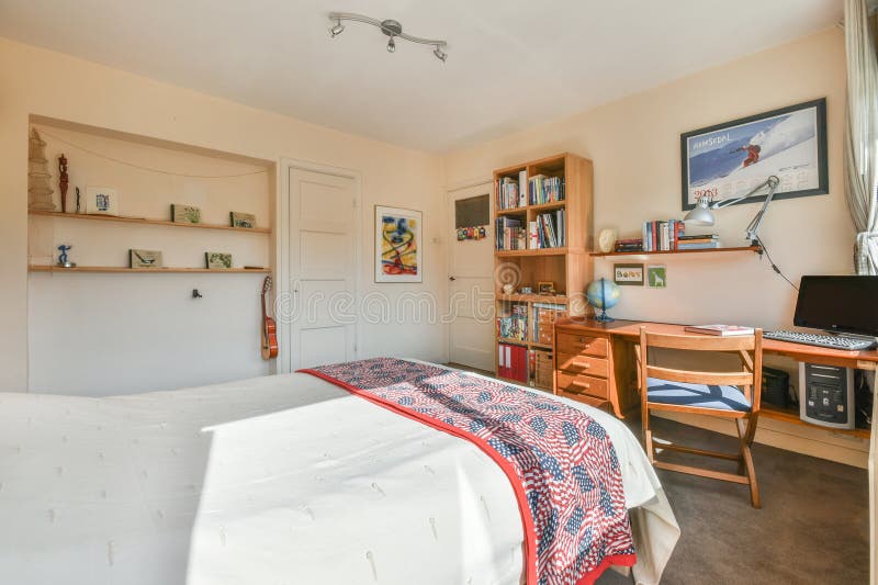 A Bedroom with a Bed Desk and a Computer Editorial Stock Photo - Image ...