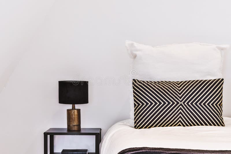 Bedside Table and Bed with Cushions Stock Photo - Image of decorative ...