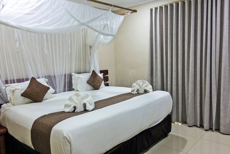 Bedroom Interior. a Bed with White Sheets and a Brown Bedspread Stock ...