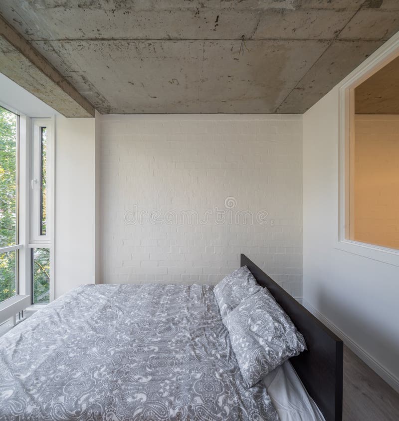 Bed in the Apartment. Bedroom in Studio Apartment. Stock Image - Image ...