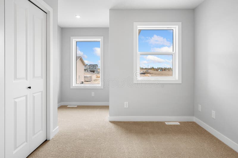 Bedroom with a White Door and Two Windows Stock Photo - Image of ...