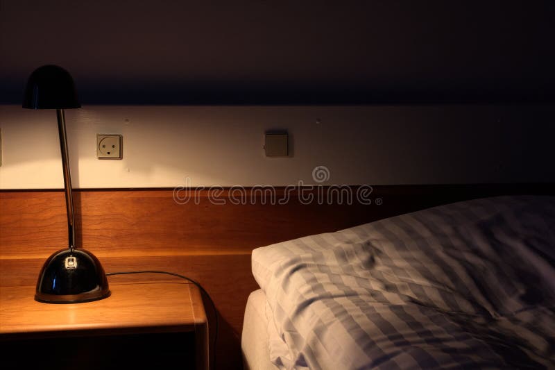 Bedside at night stock image. Image of home, light, lamp - 32444599