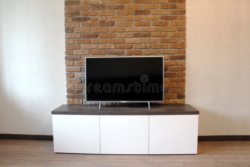 Bedside table under the TV stock photo. Image of mounted - 91437156