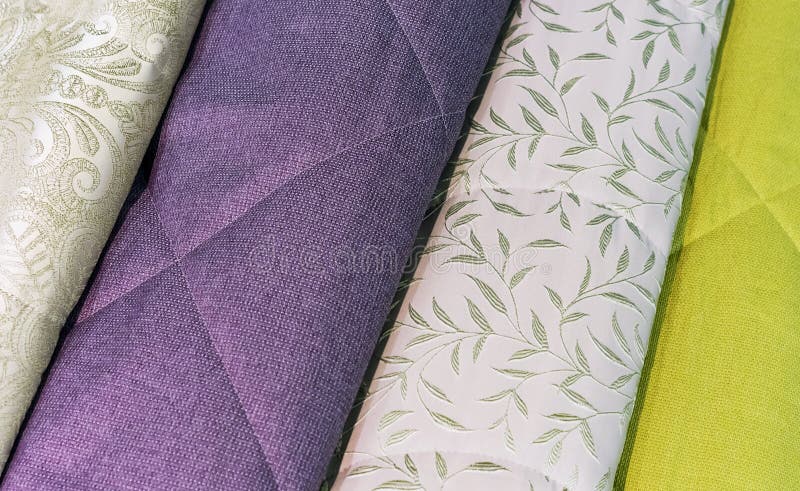 Bedspreads in Different Colors. Background from Fabric of Different ...