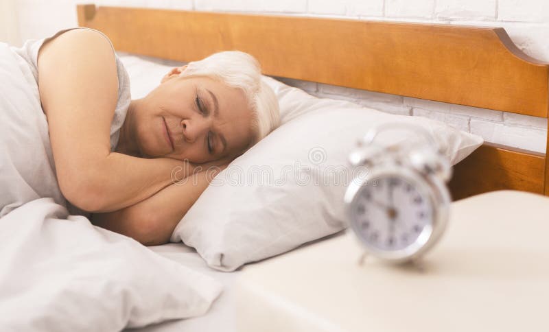 Senior Lady Sleeping in Her Bed Early in Morning Stock Image - Image of ...
