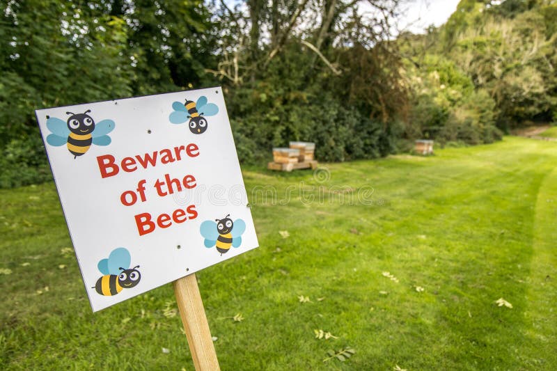 A Bee Awareness Warning Sign in Front of Bee Hives Stock Image - Image ...