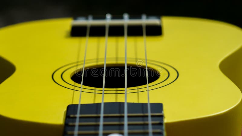 Small Yellow Guitar with Strings Stock Image - Image of country ...