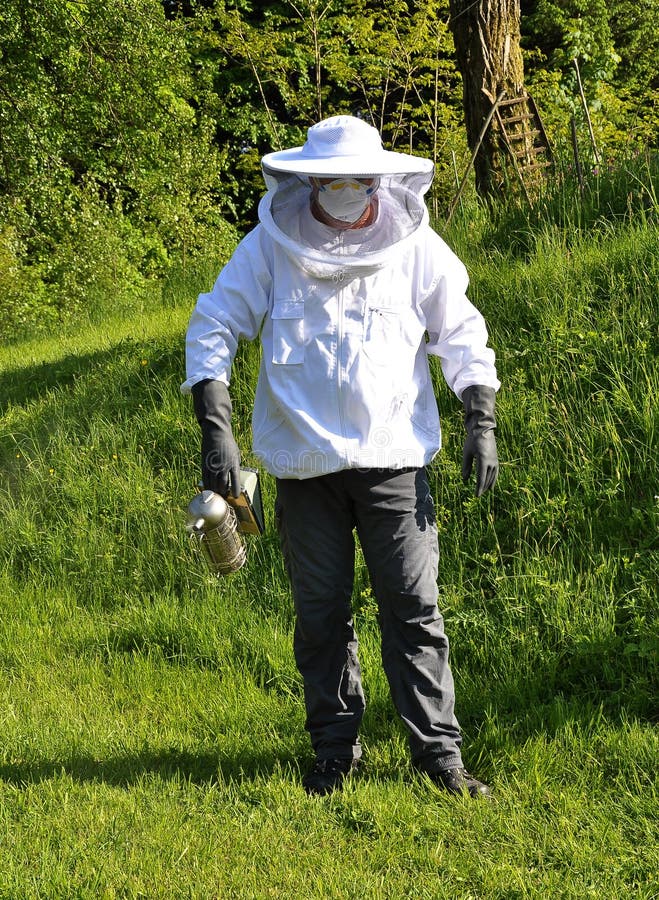 Bee-keeper In A Protective Suit Stock Photo - Image of keeper, nature ...