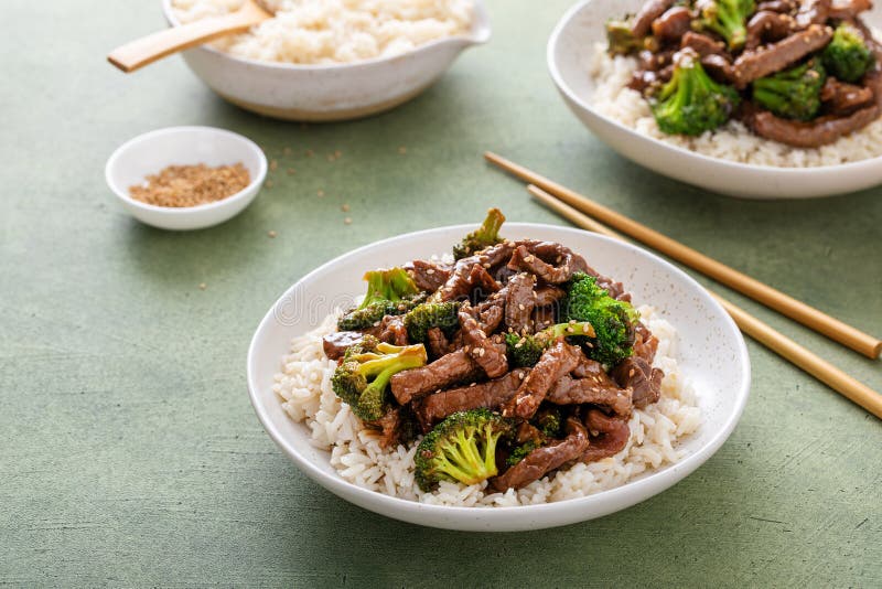 Beef and Broccoli Stir Fry Served Over Rice Stock Photo - Image of food ...