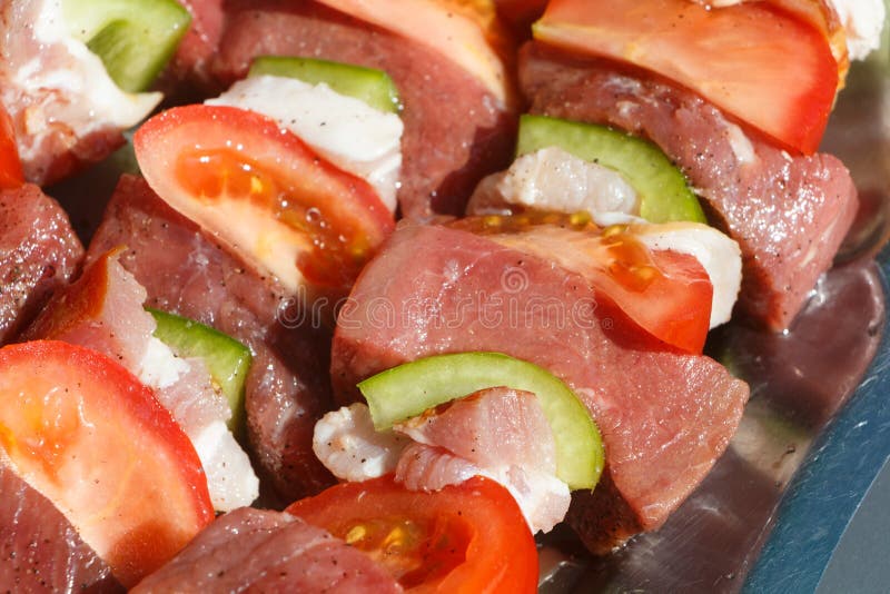 Beef brochette on a dish stock photo. Image of tomato - 157426100