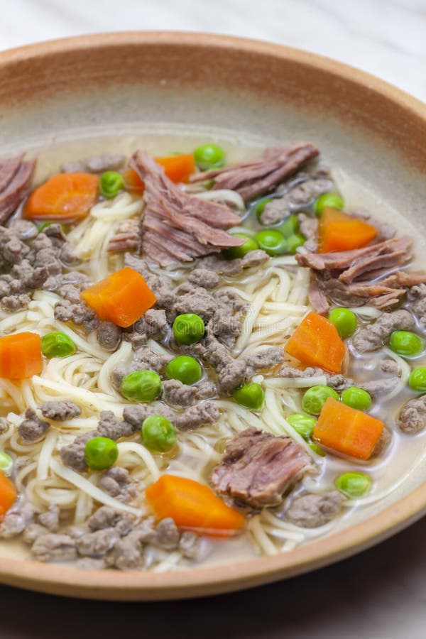 Beef Broth with Green Peas, Carrot and Small Meatballs Stock Photo ...