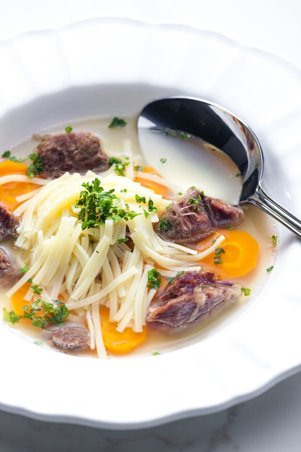 Beef Broth with Noodles and Carrot Stock Photo - Image of close, bowl ...
