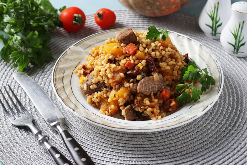 Beef with Bulgur and Vegetables Such As Pumpkin, Carrots, Onions and ...