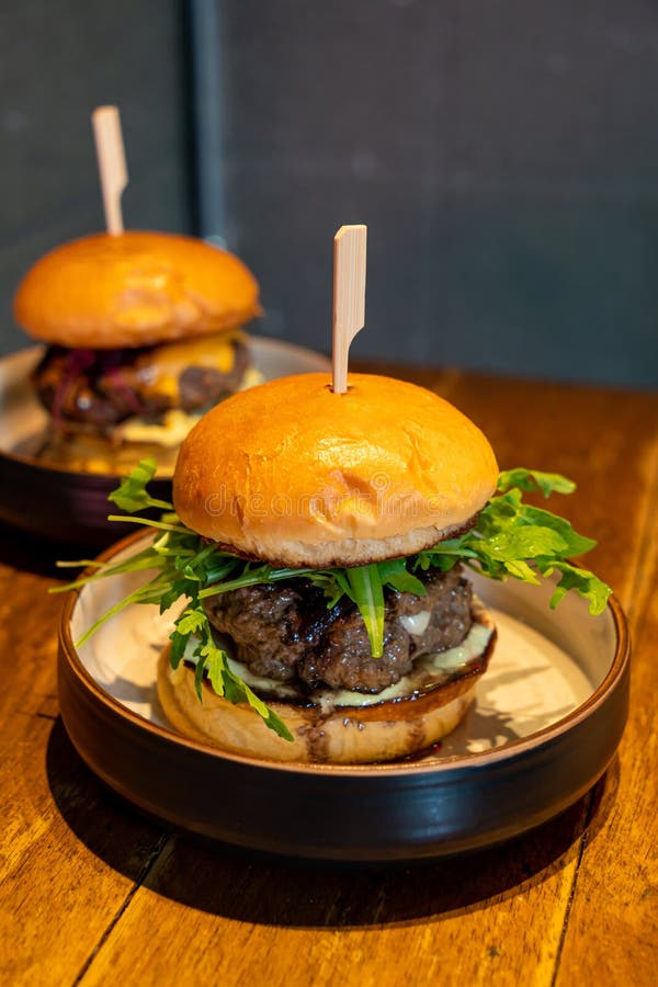 Beef Burger with Cheese on Plate Stock Image - Image of burger, brown ...