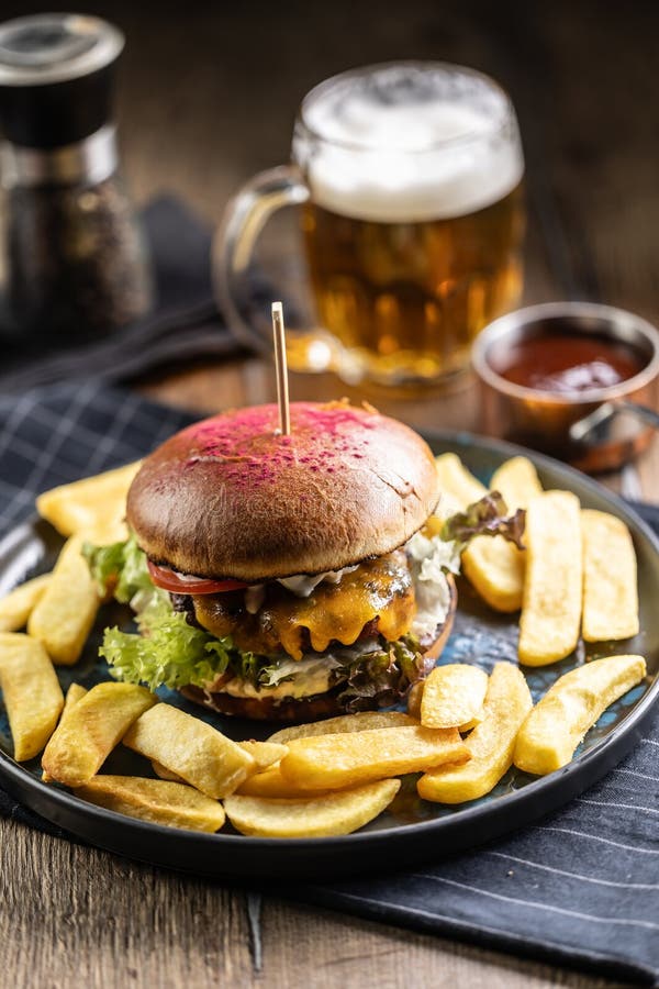 Beef Burger with Fries and Draft Beer on a Pub or Restaurant Plate ...