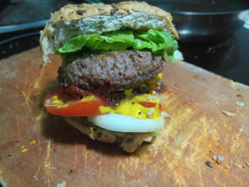 Beef Burger Preparation on a Clean Wooden Surface Stock Photo - Image ...
