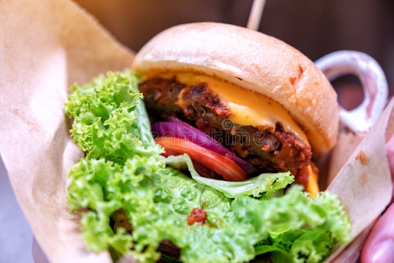 A Beef Cheeseburger in Restaurant Stock Photo - Image of bowl, burger ...