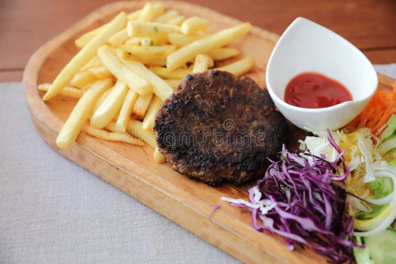 Beef Cutlet for Steak with Fires and Vegetables on Wooden Tray Stock ...