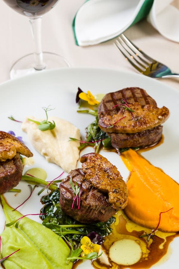 Beef filets with foie gras stock photo. Image of sauce - 104837480