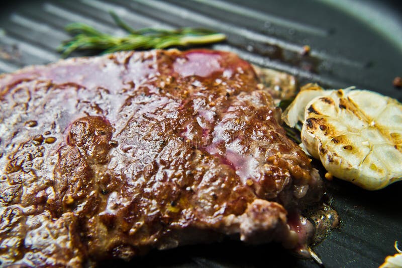 Beef Flank Steak in the Pan. Dark Background, Side View, Selective ...