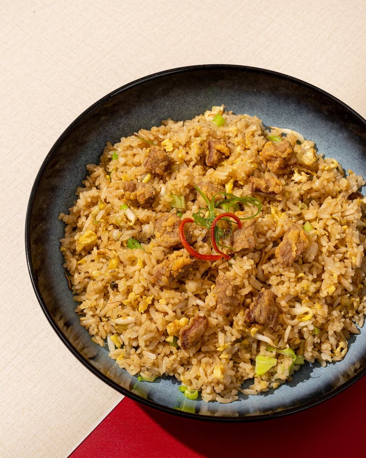 Beef Fried Rice is a Dish of Rice Fried in a Pan Which Produces a ...