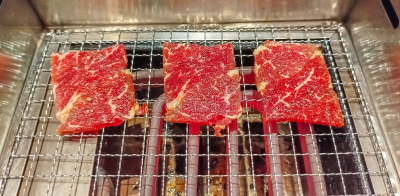 Beef Grilled on Rack in Japanese Style in Restaurant Stock Photo ...