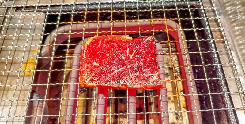 Beef Grilled on Rack in Japanese Style in Restaurant Stock Photo ...