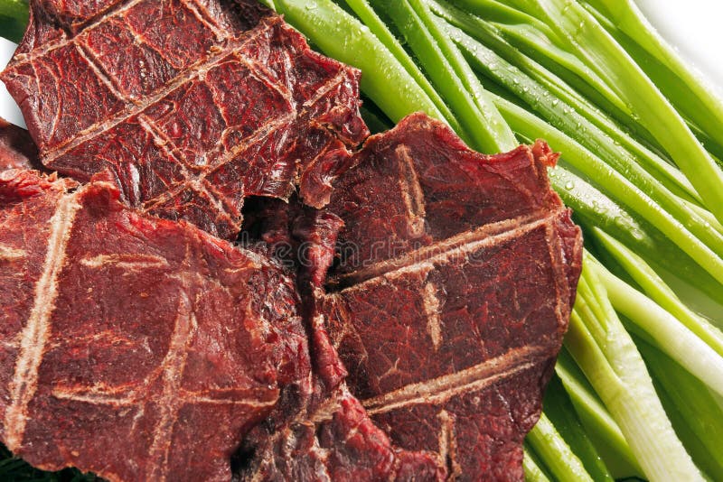 Pile of Black Pepper Beef Jerky on a Rustic Wooden Table Stock Photo ...