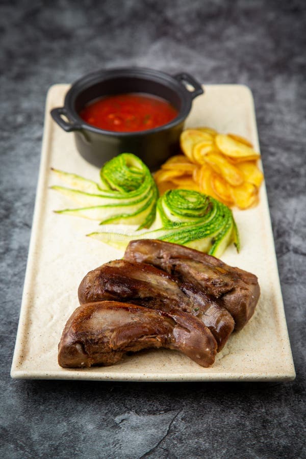 Beef Meat with Chips, Cucumbers and Barbecue Sauce, Side View Stock ...