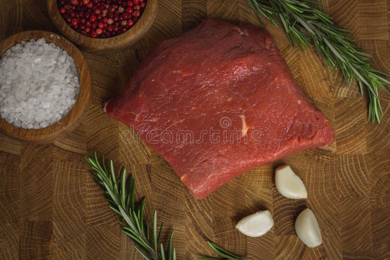 Beef Meat Close -up with Rosemary, Garlic and Salt Stock Image - Image ...