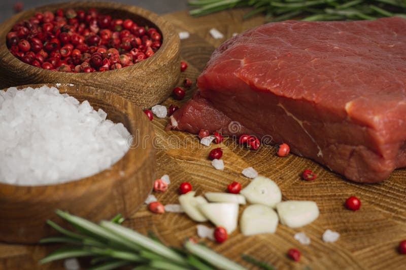 Beef Meat Close -up with Rosemary, Garlic and Salt Stock Photo - Image ...
