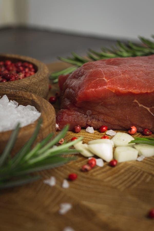 Beef Meat Close -up with Rosemary, Garlic and Salt Stock Photo - Image ...