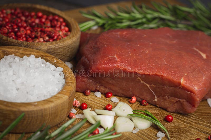 Beef Meat Close -up with Rosemary, Garlic and Salt Stock Image - Image ...