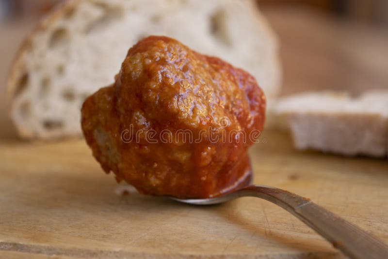 Beef meatball on a spoon stock photo. Image of sauce - 271303544