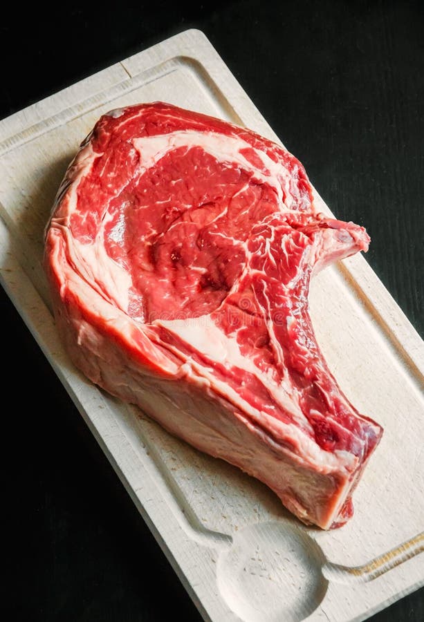 Beef Prime Rib on a Cutting Board Stock Photo - Image of beef, prime ...