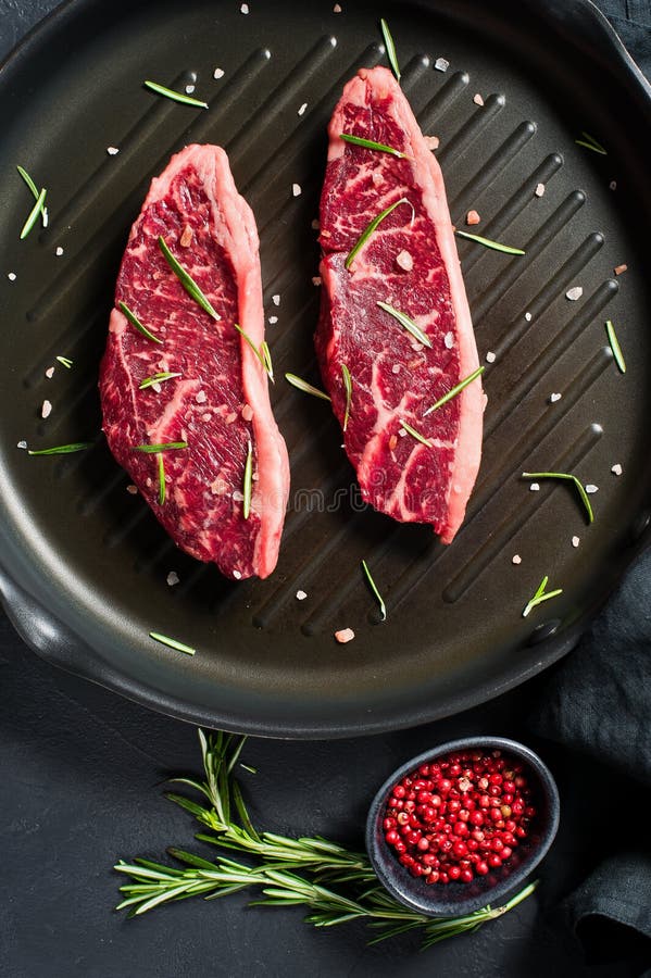 Beef Ramp Steak with Rosemary. Black Background, Top View. Stock Image ...