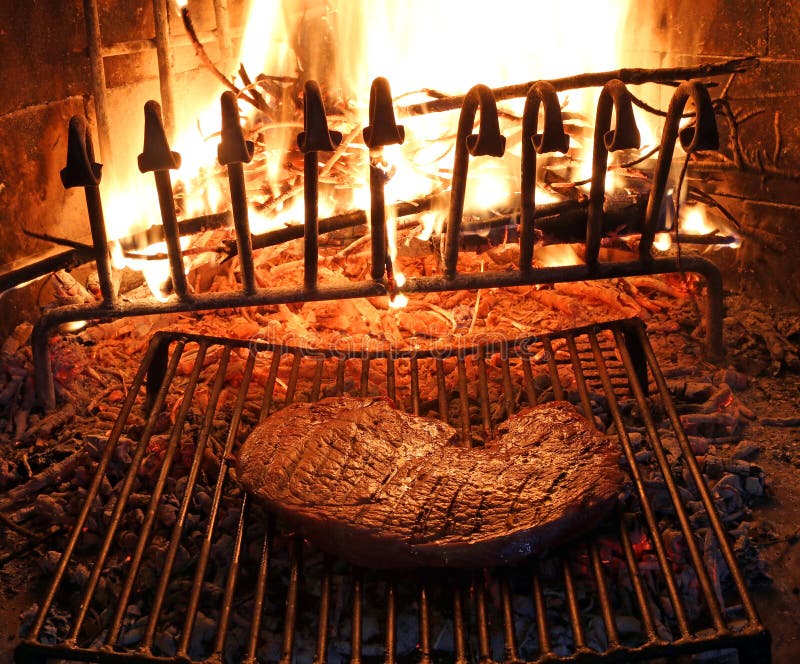 Beef Steak Cooked on the Barbeque Fireplace with Flame Stock Photo ...