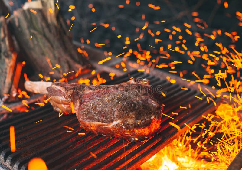 Beef Steak is Cooked on Fire. Beef Rib BBQ . Stock Photo - Image of ...