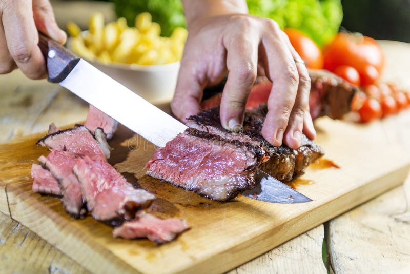 Beef Steak Cut on Chopping Board Stock Image - Image of grilled, piece ...