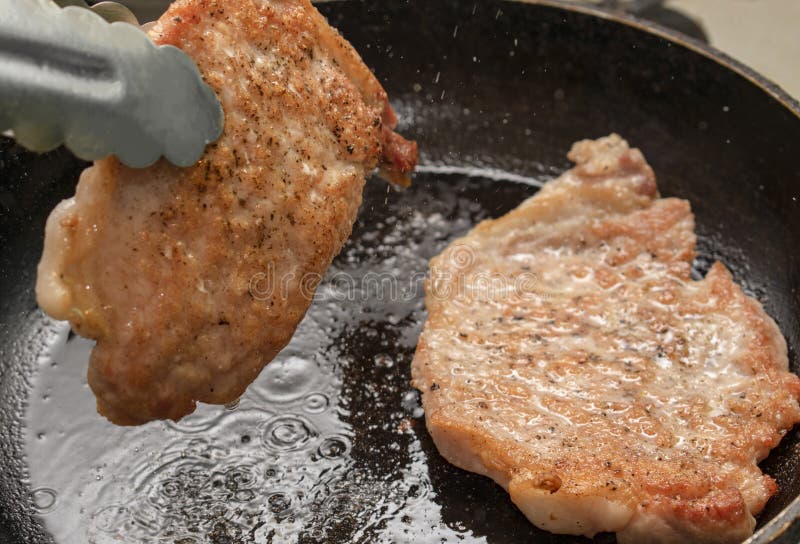 Beef Steak Fried in Pan. Chef Turns Steak Over Stock Photo - Image of ...