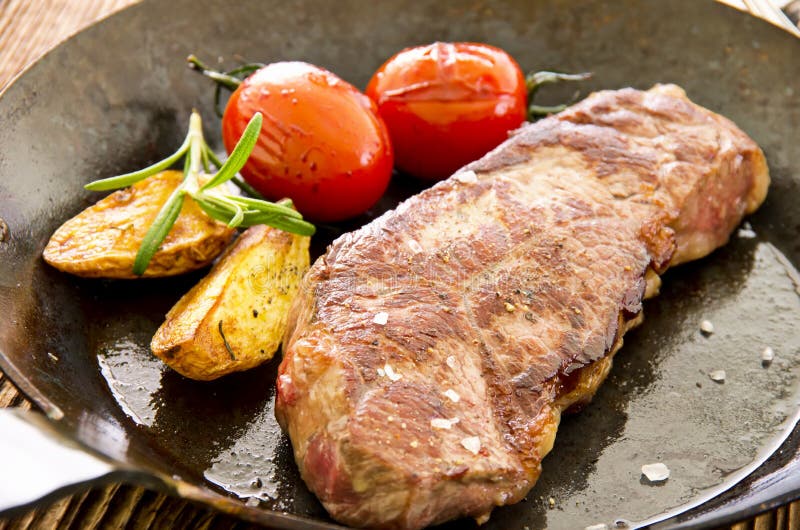 Beef Steak in Fry Pan stock photo. Image of diet, prime - 35122968