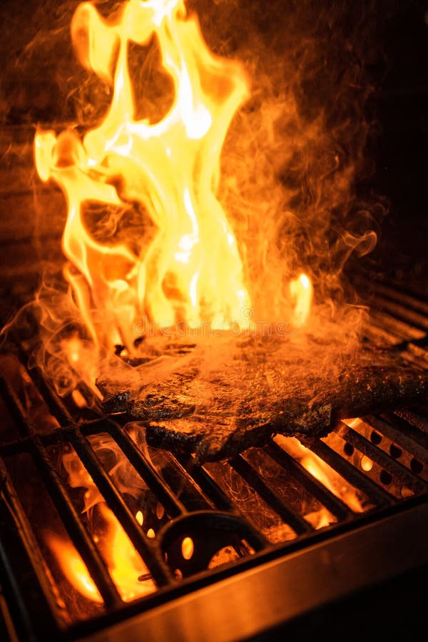 Beef Steak on the Grill with Flames Stock Image - Image of closeup ...