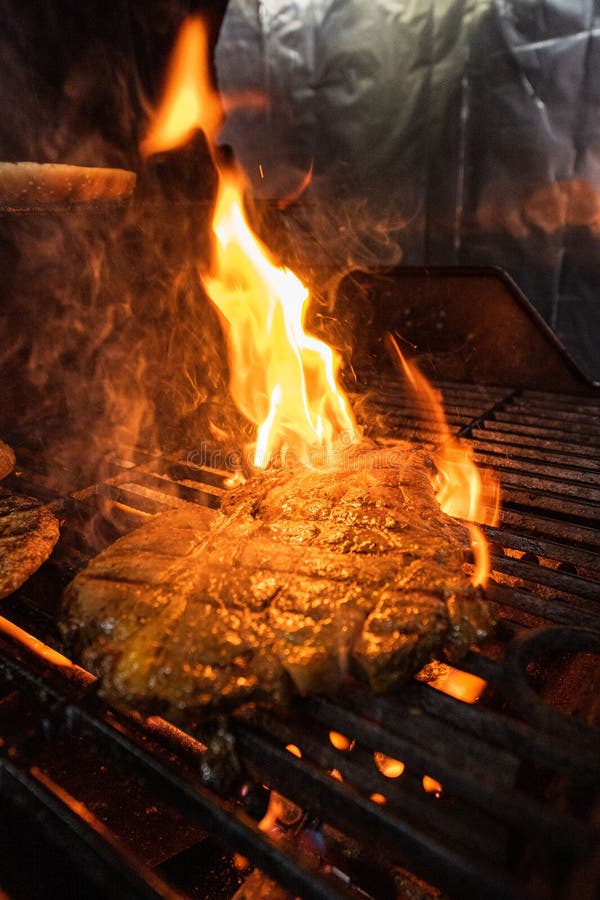 Beef Steak on the Grill with Flames Stock Photo - Image of cookout ...