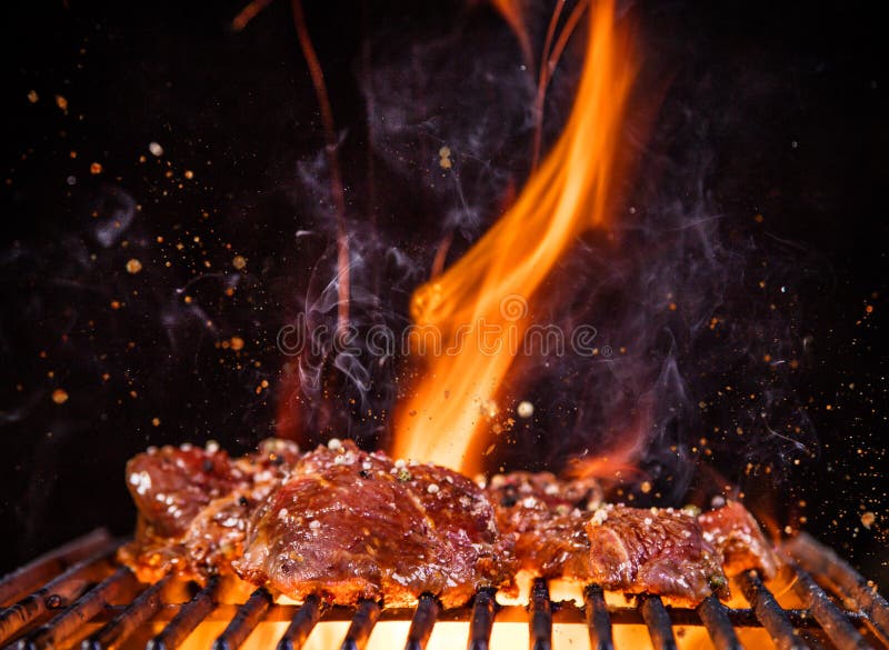 Beef Steak on the Grill with Flames Stock Photo - Image of herb ...