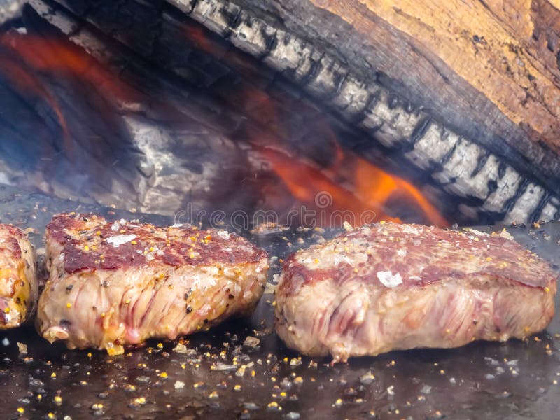 Beef Steak on the Grill, with Wild Wood. Stock Photo - Image of green ...