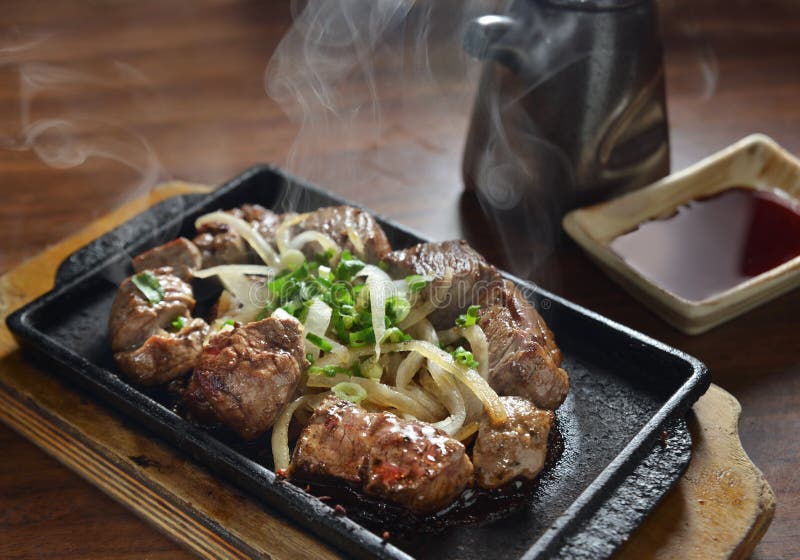 Beef steak hot pan stock image. Image of lamp, french - 156240147