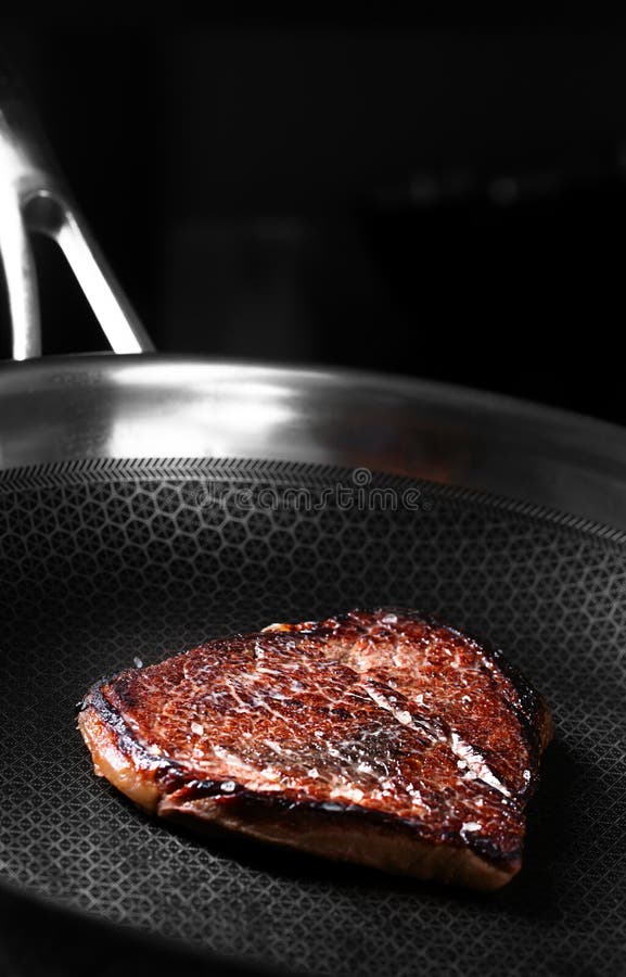 Beef Steak is Preparing on the Dark Pan Stock Image - Image of dark ...