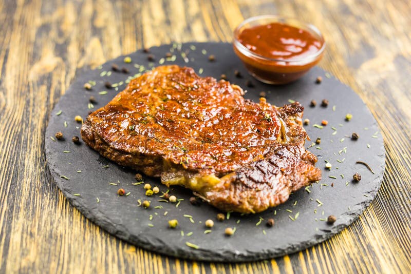 Beef Steak on a Wooden Table. Stock Photo - Image of menu, meal: 74922950